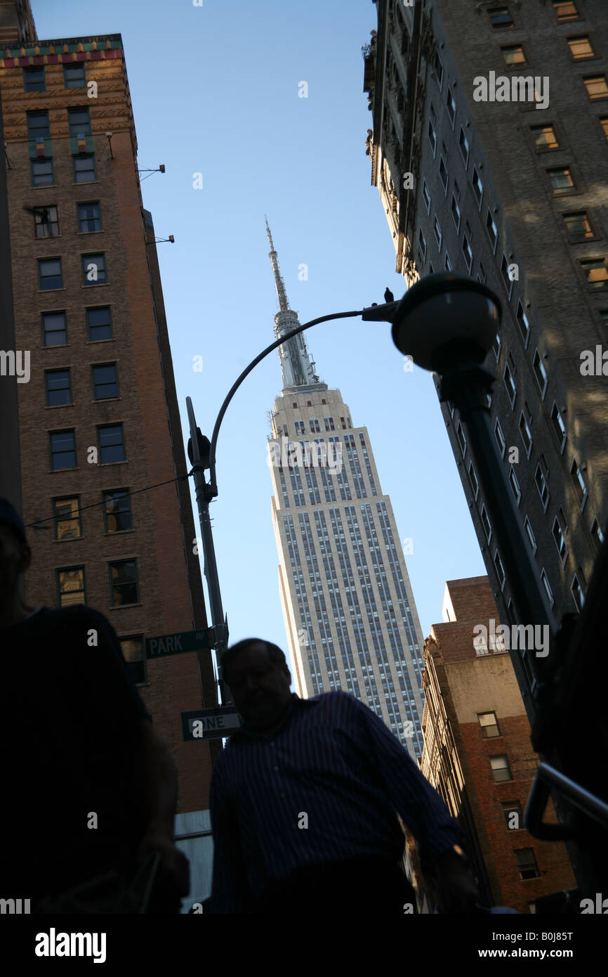 Person exiting subway in New York City, Empire State Building in ...