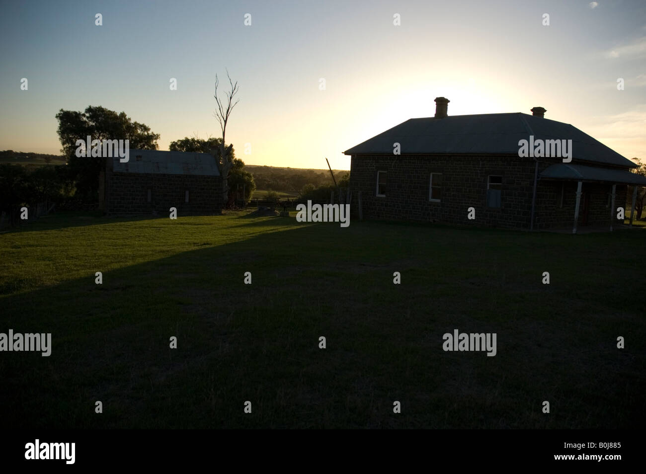 Heritage blue-stone farm in semi silhouette at dusk Stock Photo - Alamy