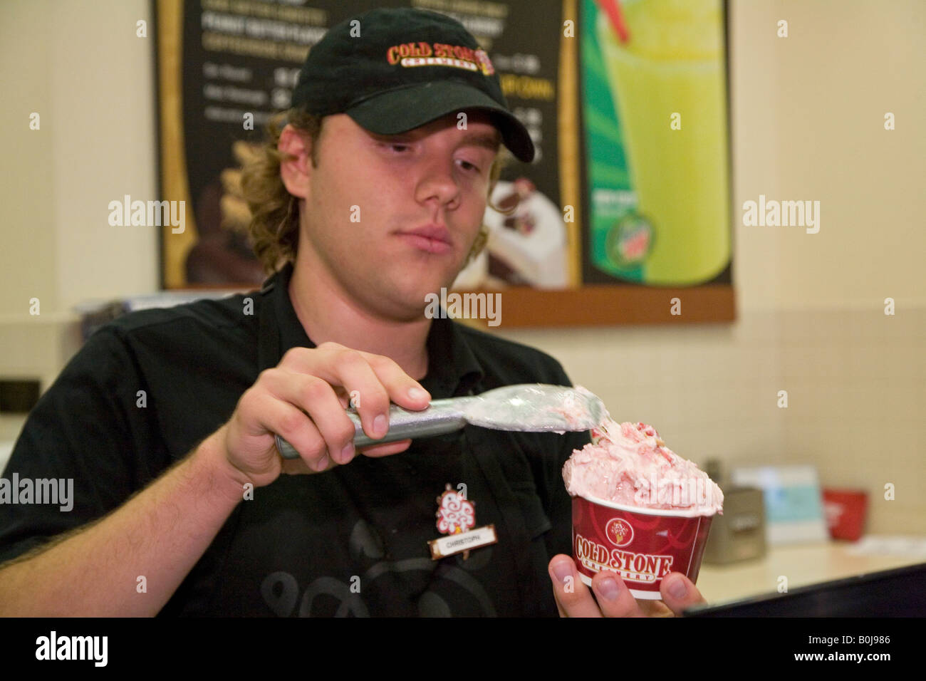 Teenage Worker at Ice Cream Store Stock Photo - Alamy