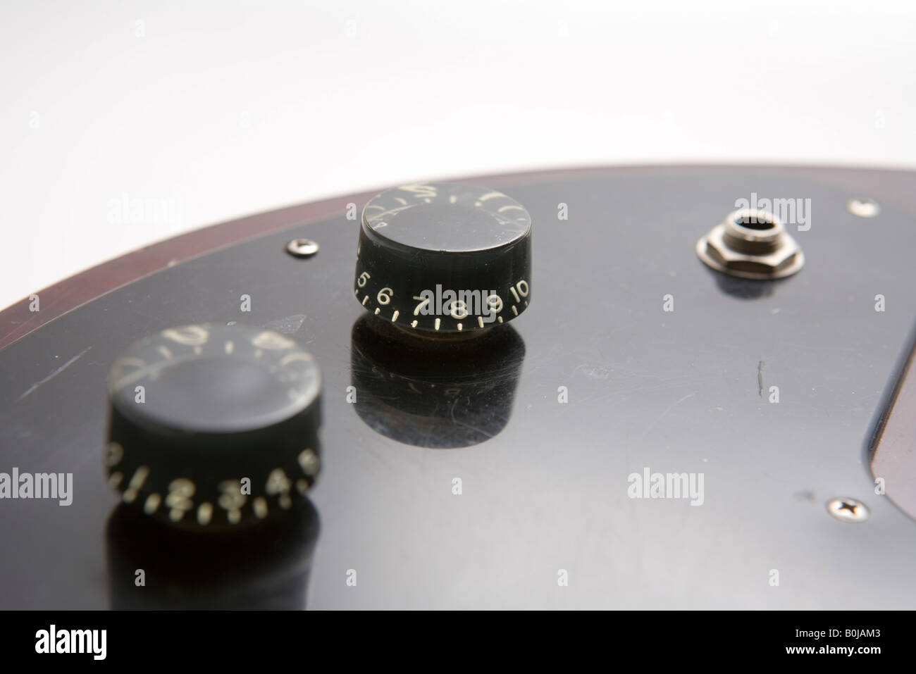 Electric bass guitar adjusting knobs Stock Photo - Alamy