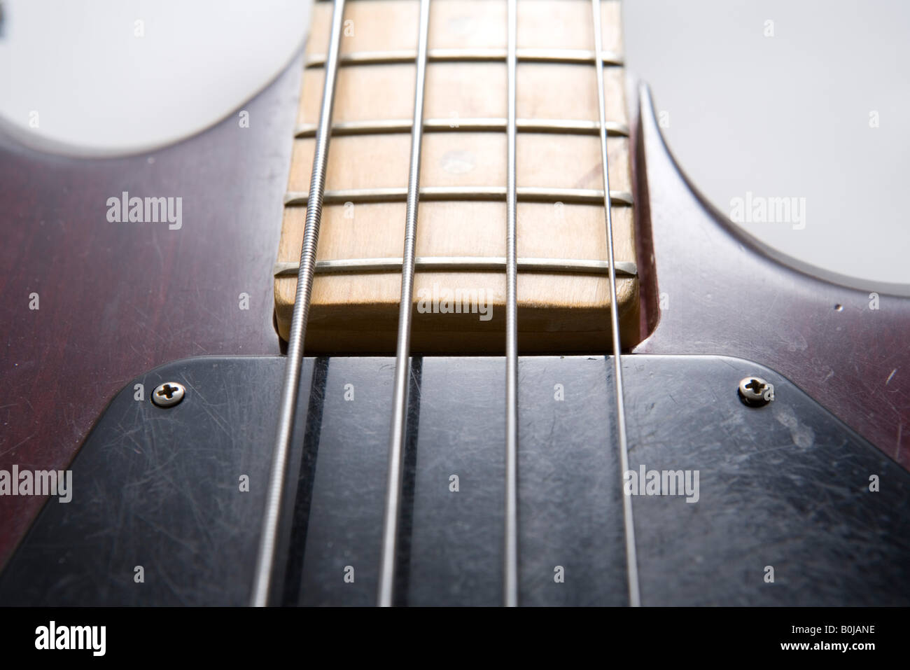 Electric bass guitar with four strings Stock Photo - Alamy