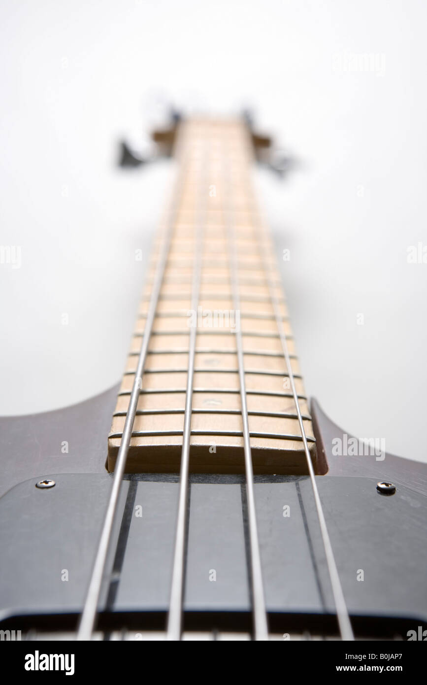 Electric bass guitar with four strings Stock Photo - Alamy