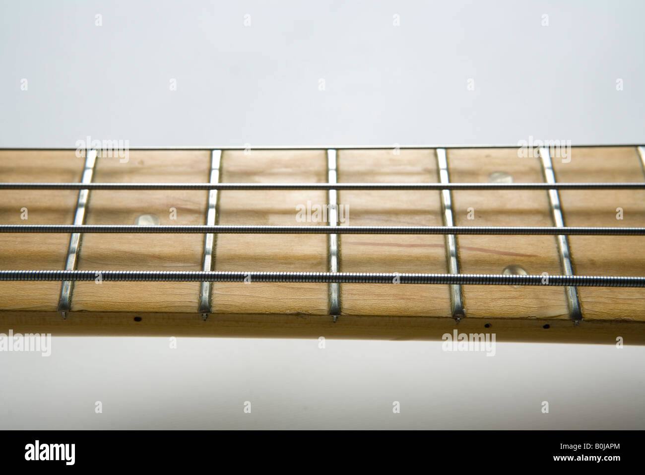 Electric bass guitar with four strings Stock Photo - Alamy