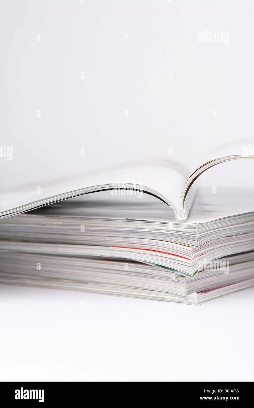Stack of glossy periodical magazines Stock Photo - Alamy