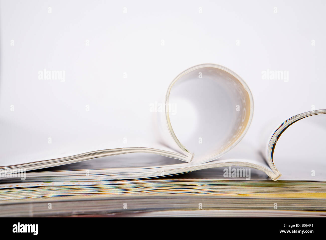 Stack of glossy periodical magazines Stock Photo - Alamy