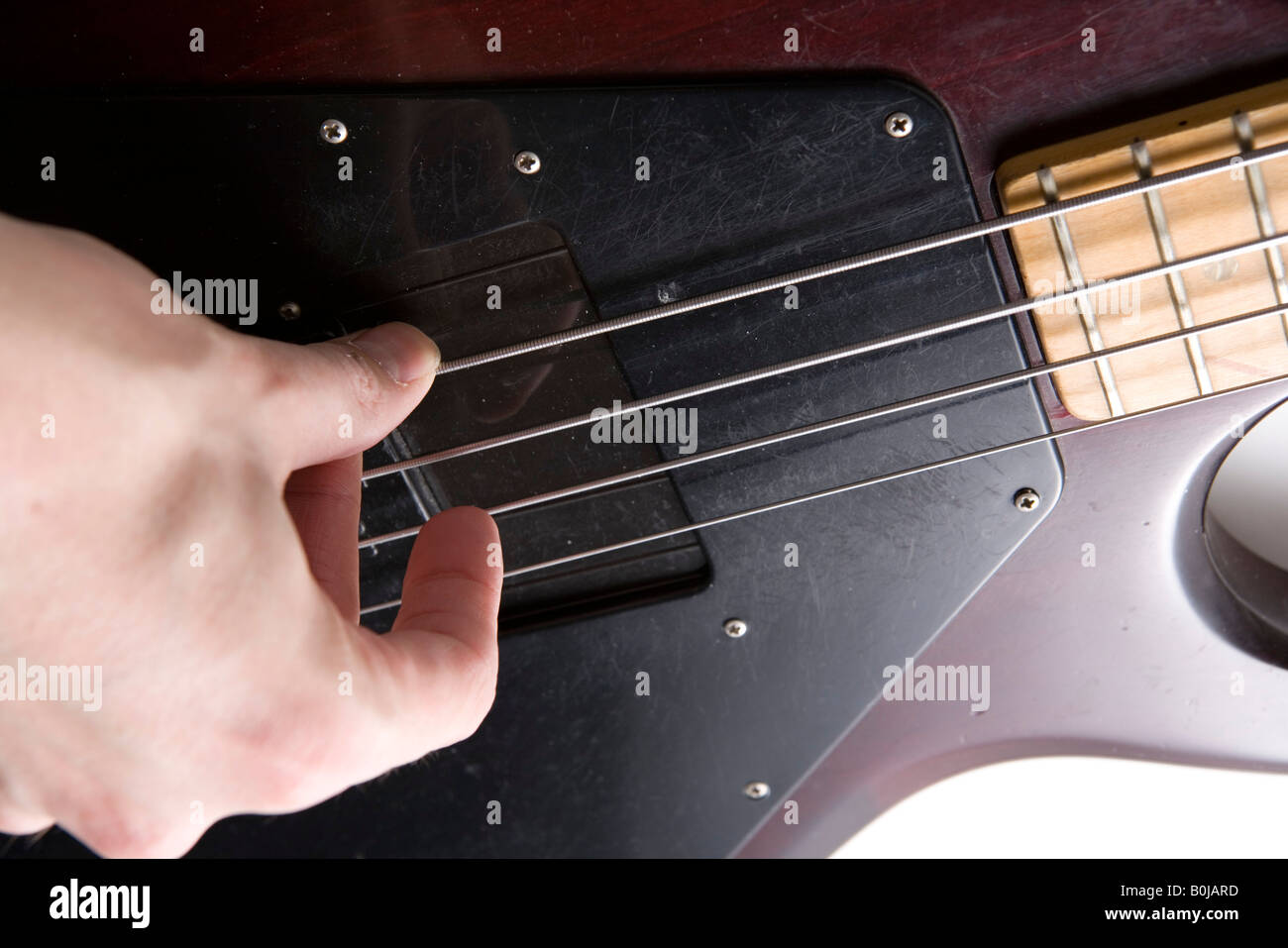 Electric bass guitar with four strings Stock Photo - Alamy