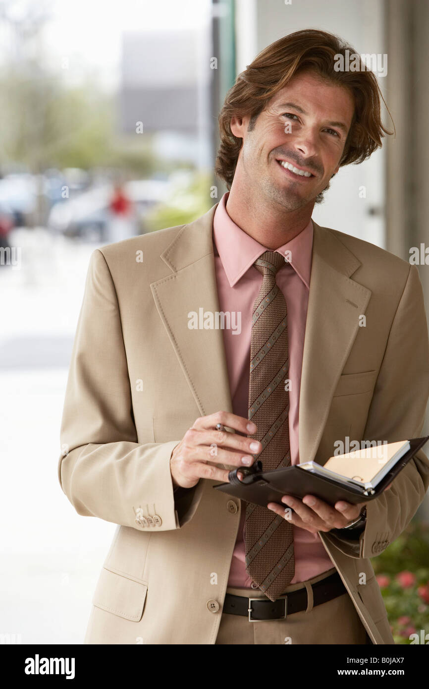 Businessman Using Organizer Stock Photo - Alamy