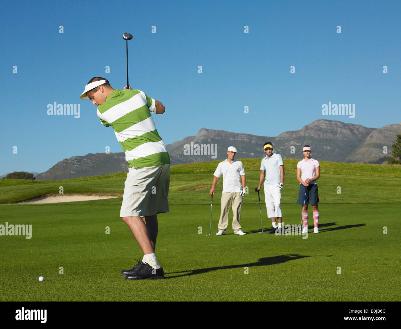 Golfer Teeing Off Stock Photo - Alamy Golfer Teeing Off Stock Photo - Alamy