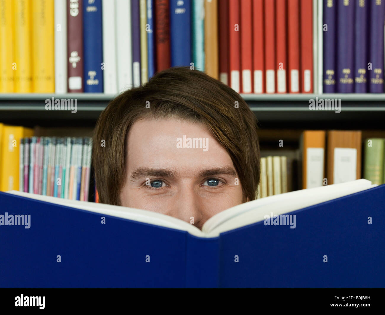 College Student Reading Book Stock Photo - Alamy
