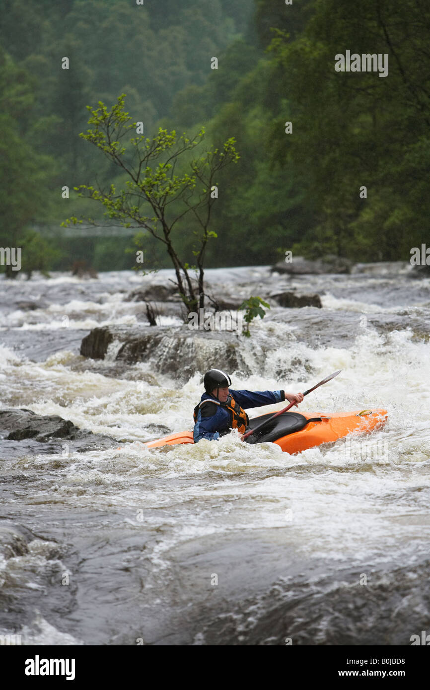 Man kayaking in river Stock Photo - Alamy