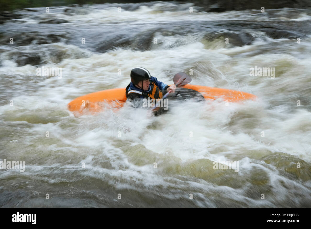 Man kayaking in river Stock Photo - Alamy