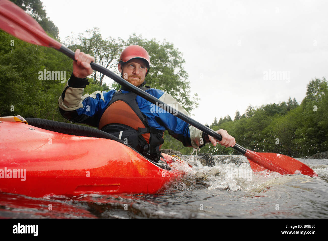 Man kayaking in river Stock Photo - Alamy