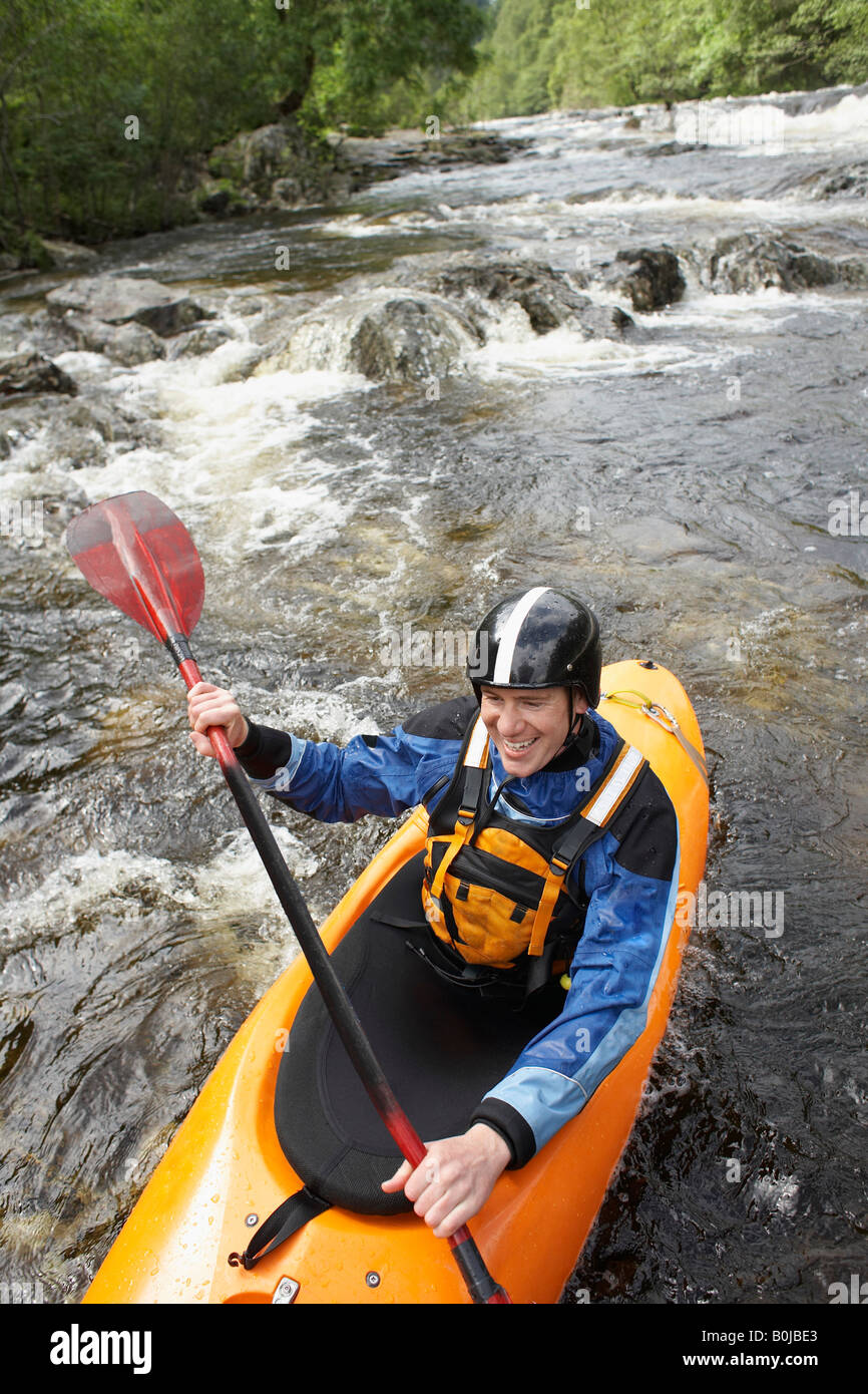 Man kayaking in river Stock Photo - Alamy