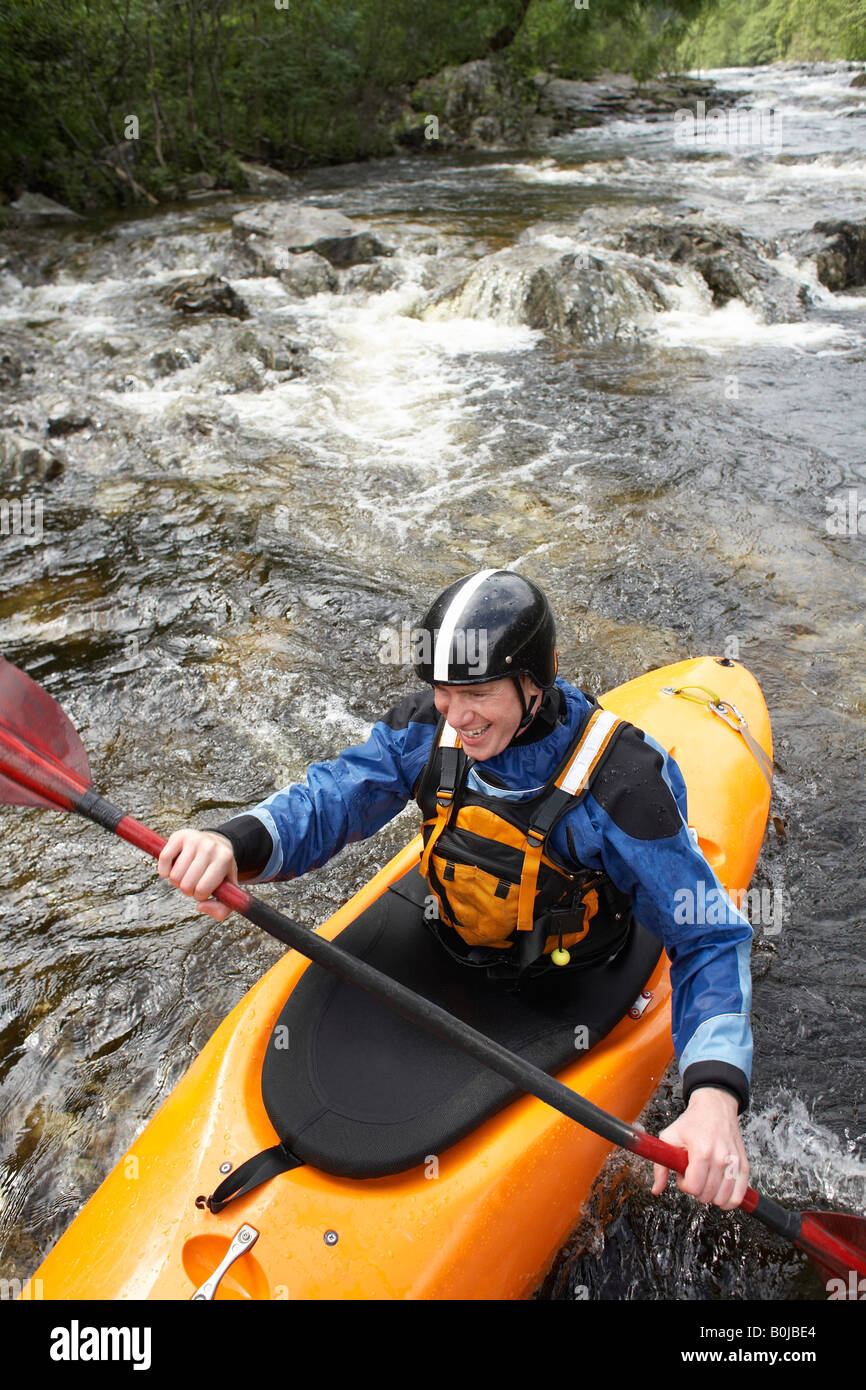 Man kayaking in river Stock Photo - Alamy