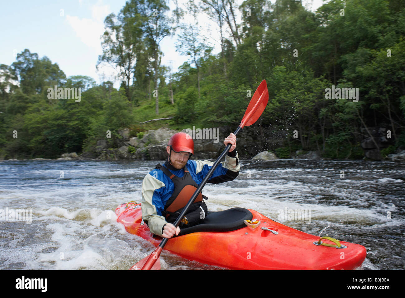 Man kayaking in river Stock Photo - Alamy