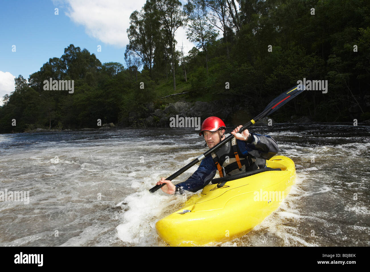 Man kayaking in river Stock Photo - Alamy