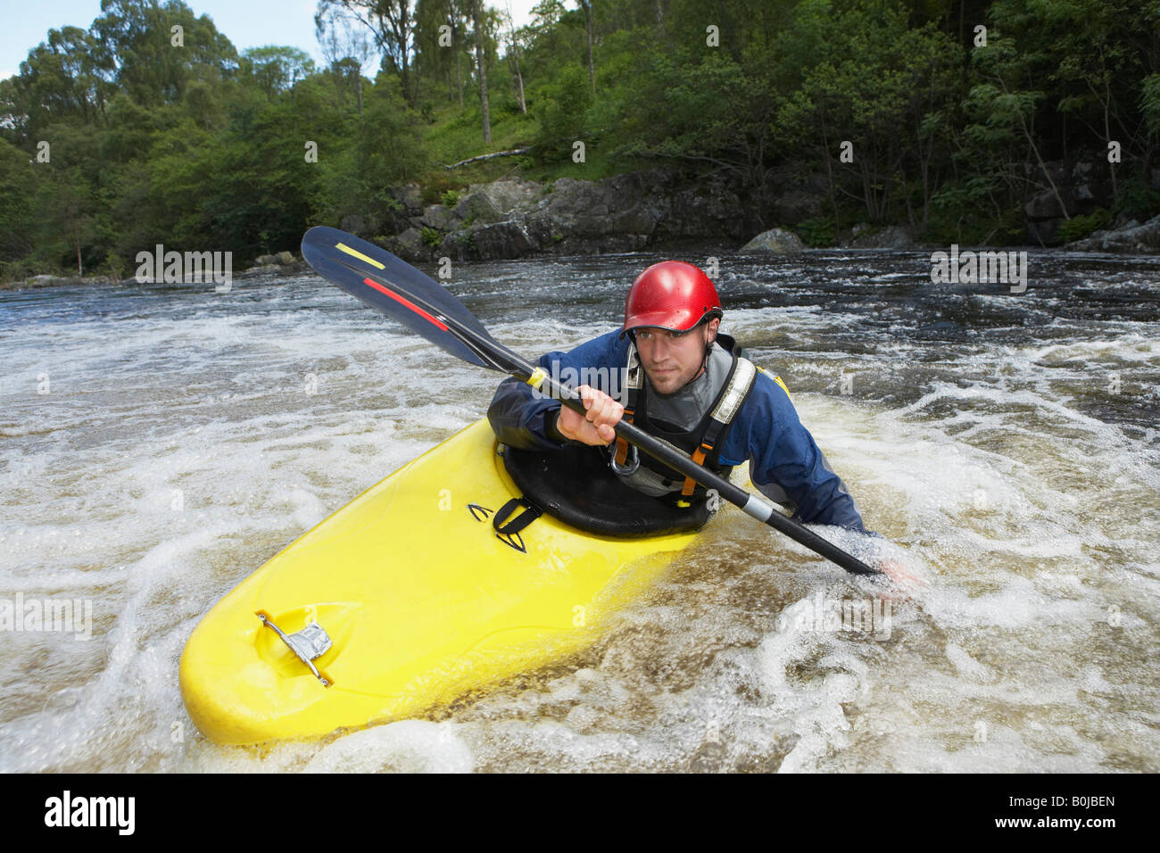 Man kayaking in river Stock Photo - Alamy