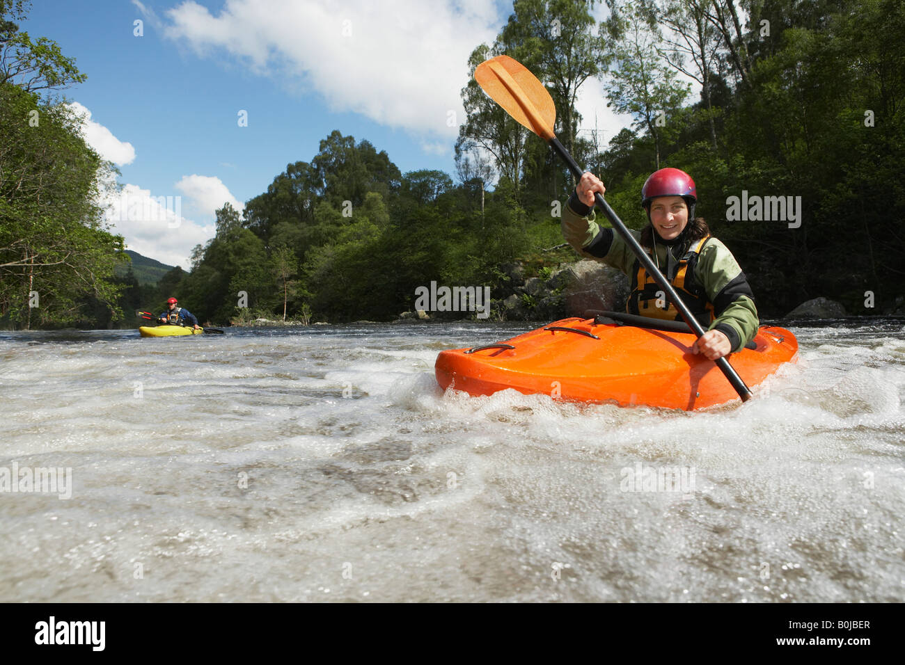 Woman kayaking in river, portrait Stock Photo - Alamy
