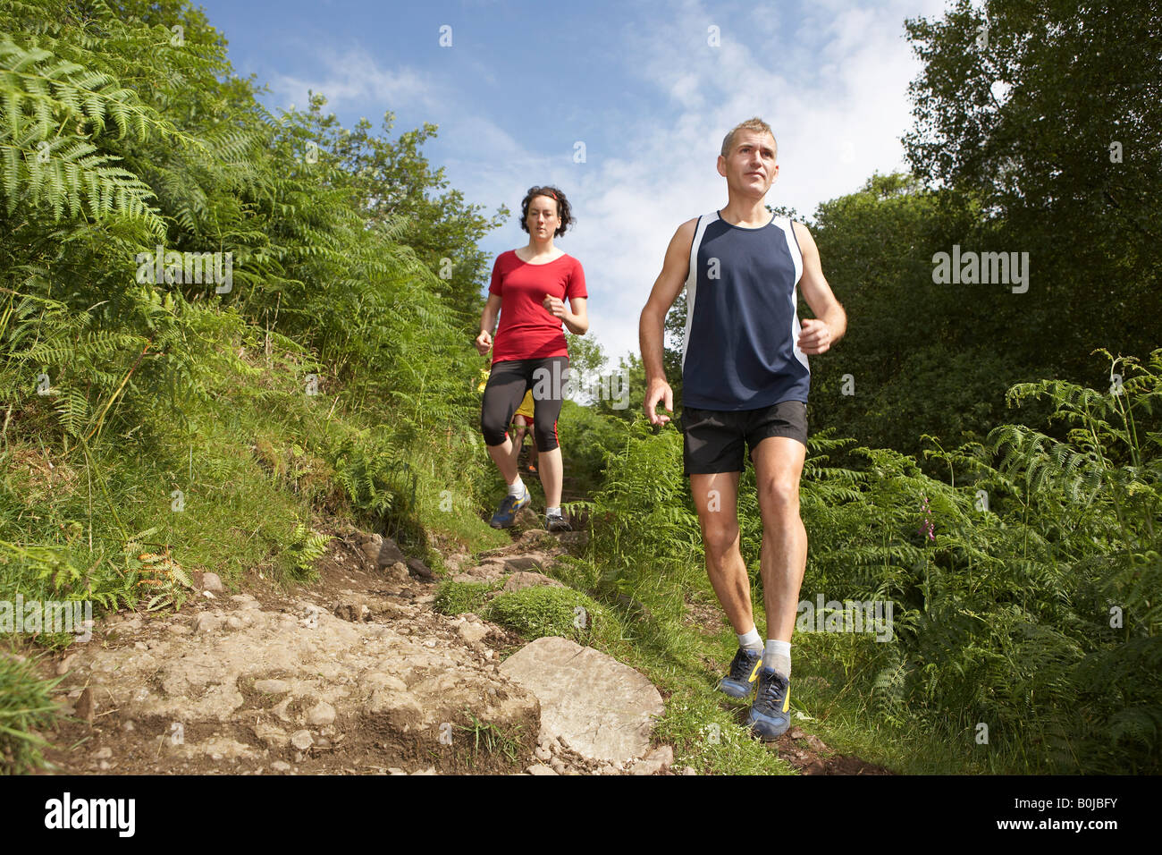 Couple hiking on trail Stock Photo - Alamy