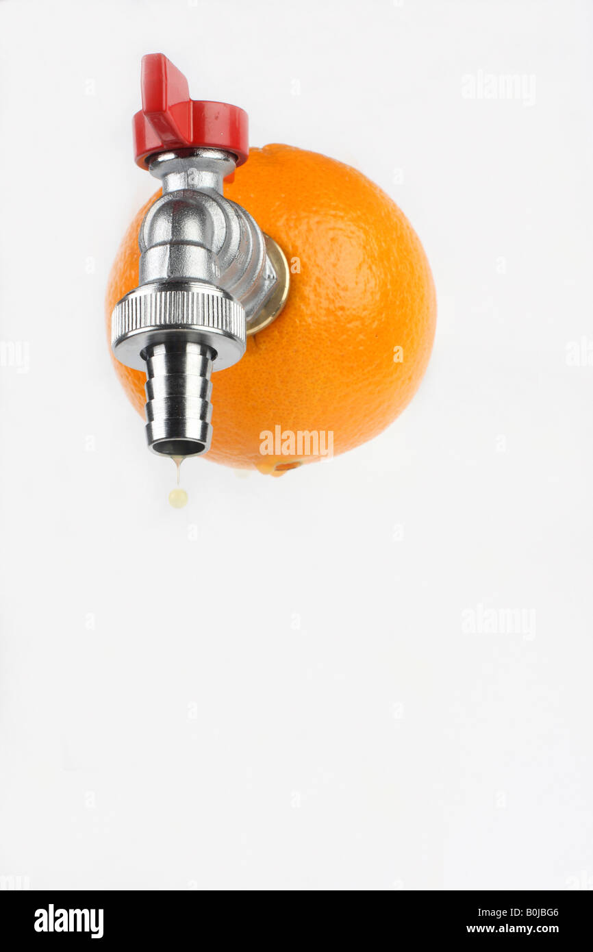 Orange with faucet and orange juice dripping from it concept of ...