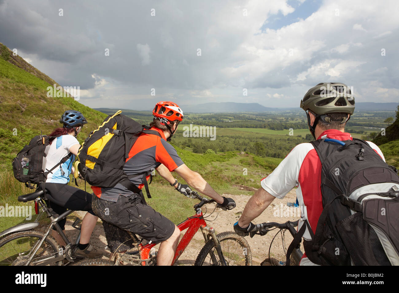 Woman with small backpack in countryside hi-res stock photography and images - Alamy
