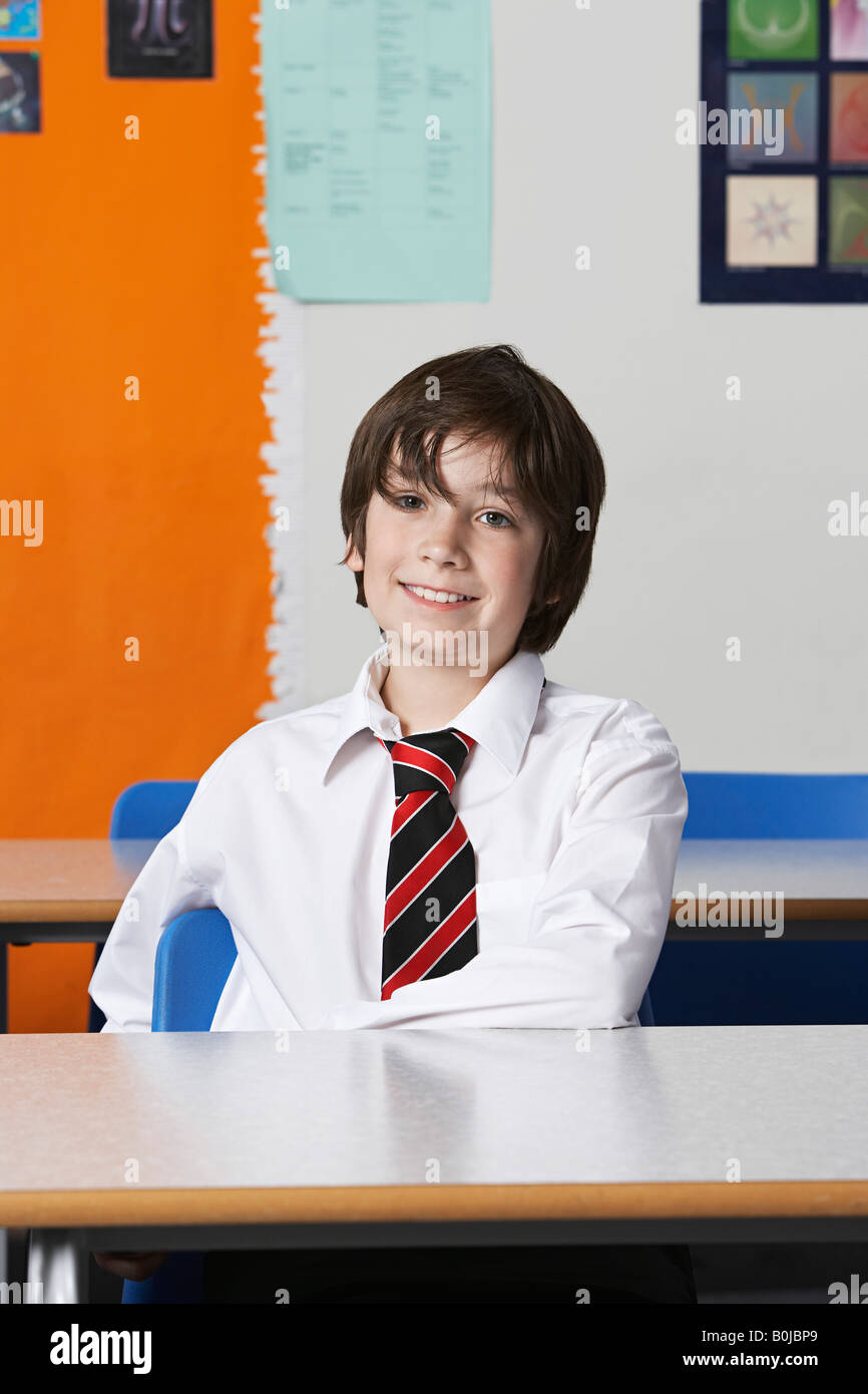 Boy (10-12) wearing shirt and tie in classroom Stock Photo - Alamy