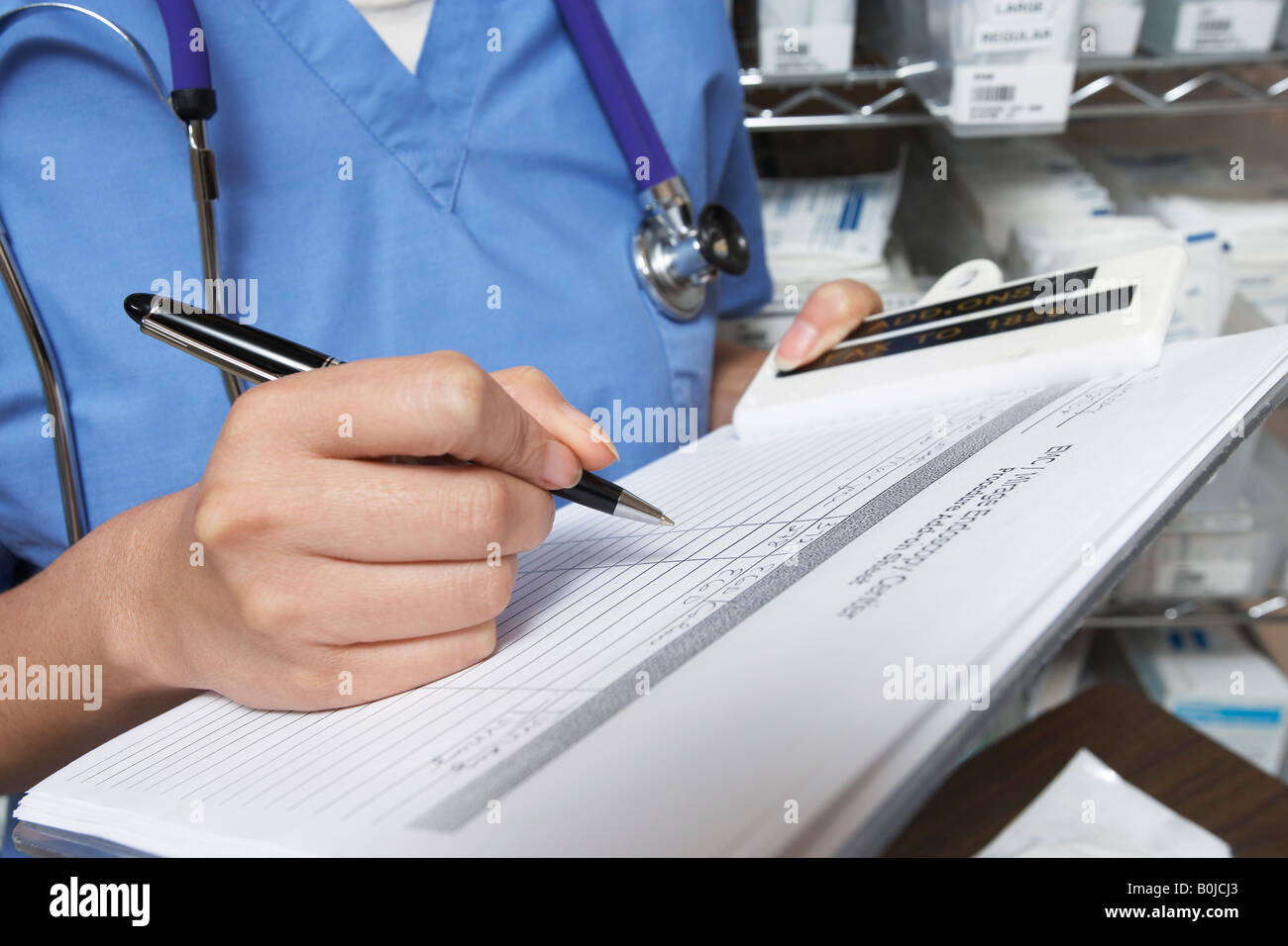 Doctor writing chart report hi-res stock photography and images - Alamy