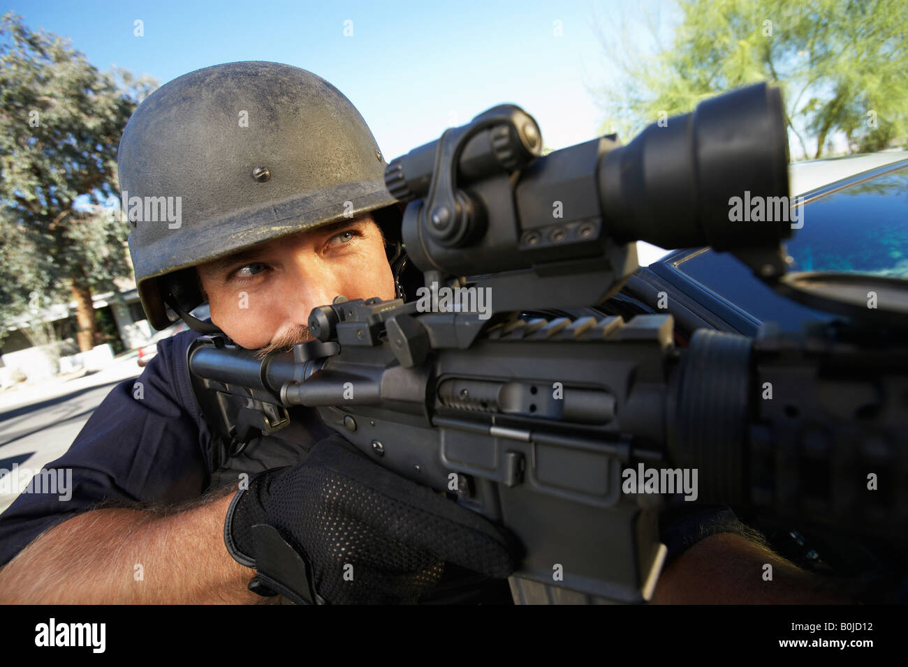 Portrait of Swat officer aiming gun Stock Photo - Alamy