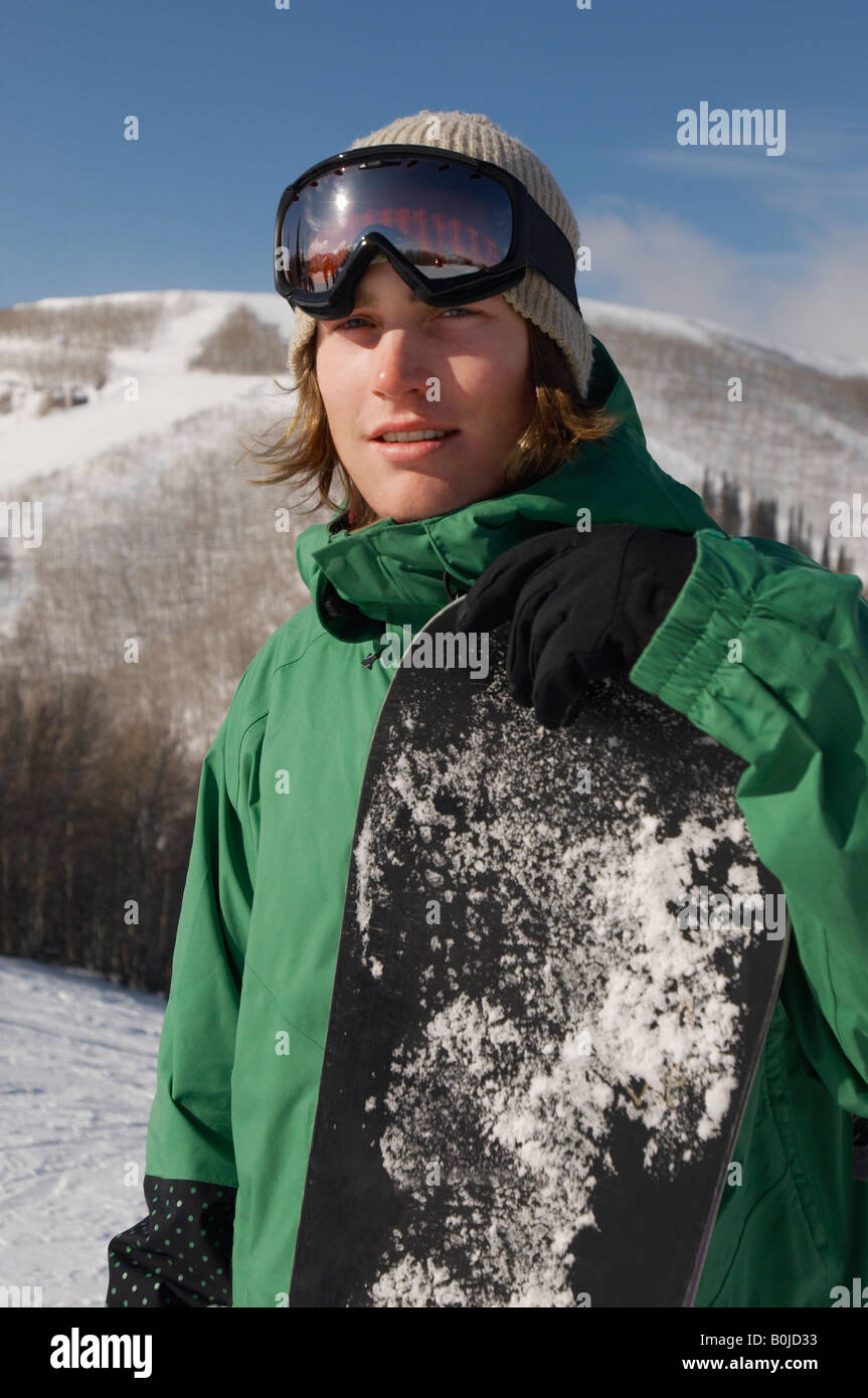 Portrait of young snowboarder smiling Stock Photo - Alamy
