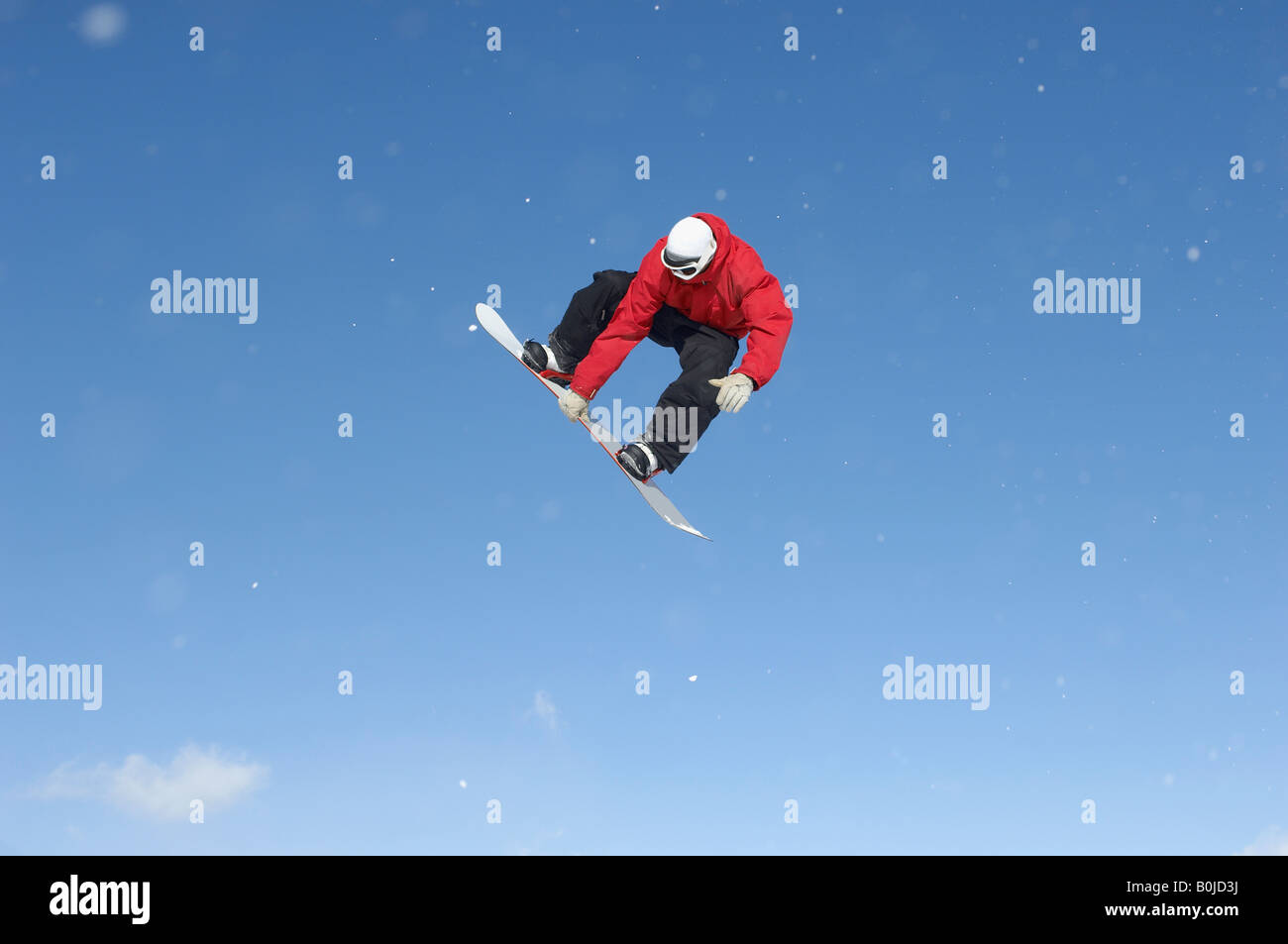 Teenage snowboarder jumping Stock Photo - Alamy