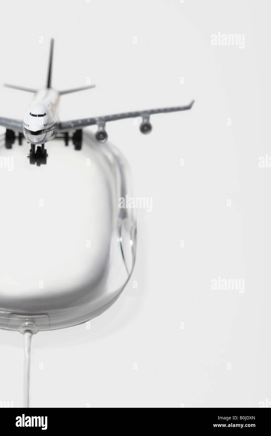 Jumbo jet on apple macintosh computer mouse, digital composite Stock ...