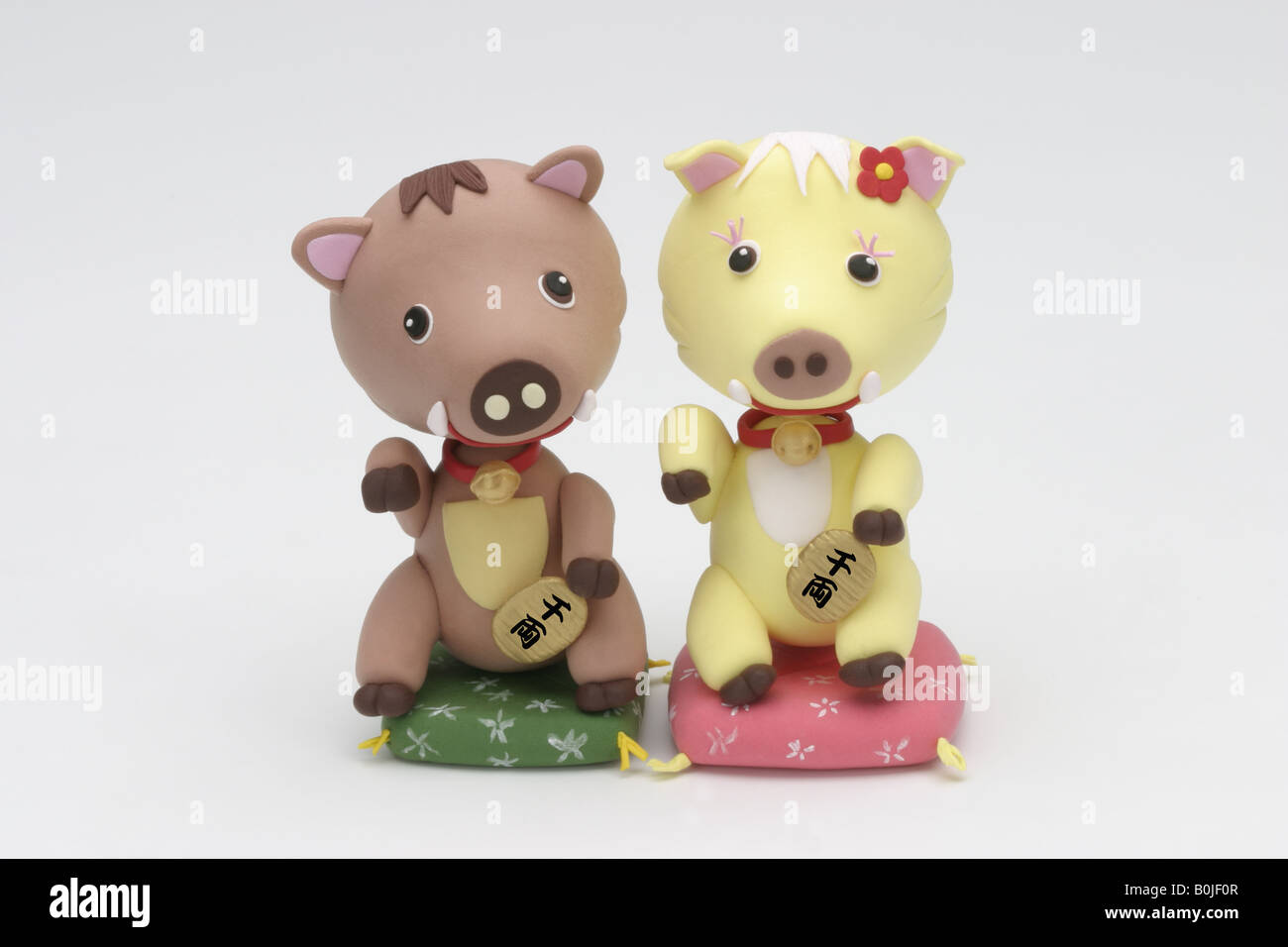 The Couple Of A Wild Boar With A Gold Coin Stock Photo - Alamy