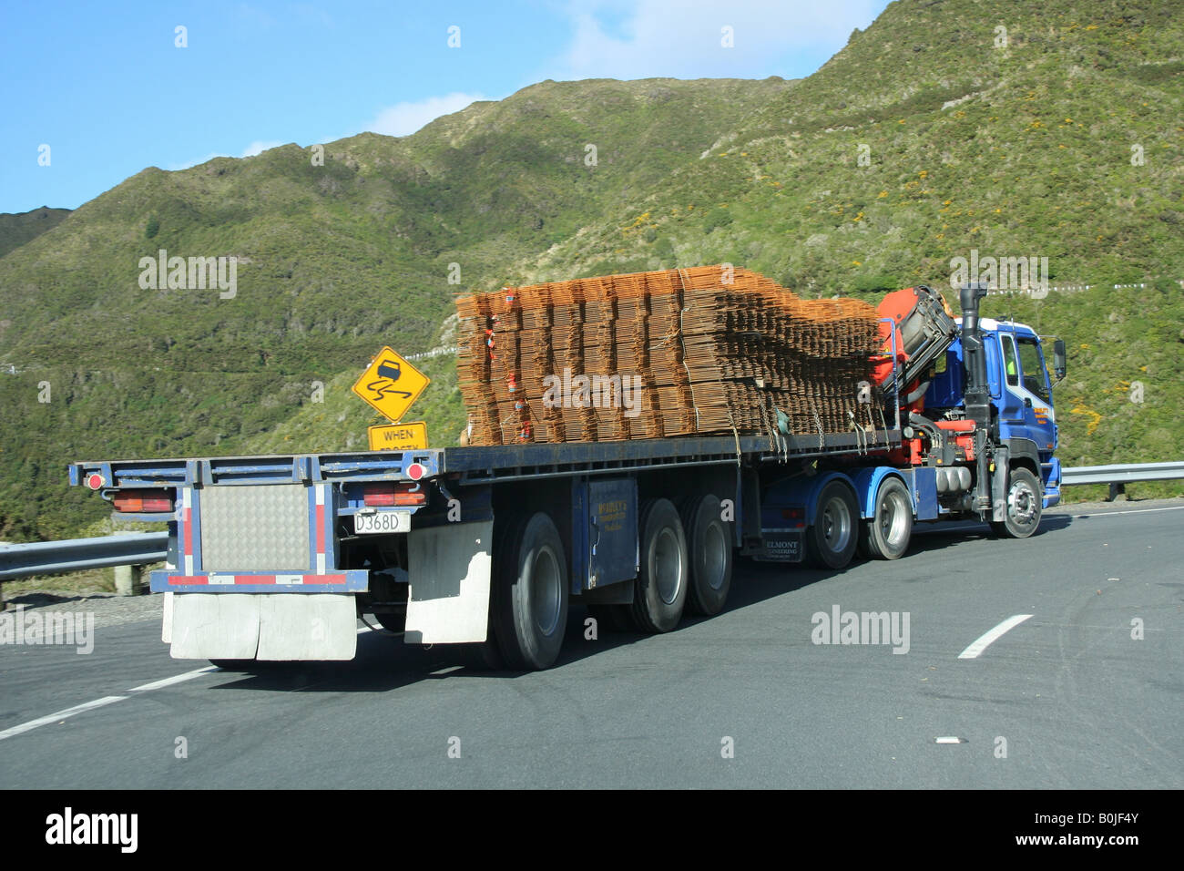 Truck hauling a load along a mountain road Stock Photo - Alamy