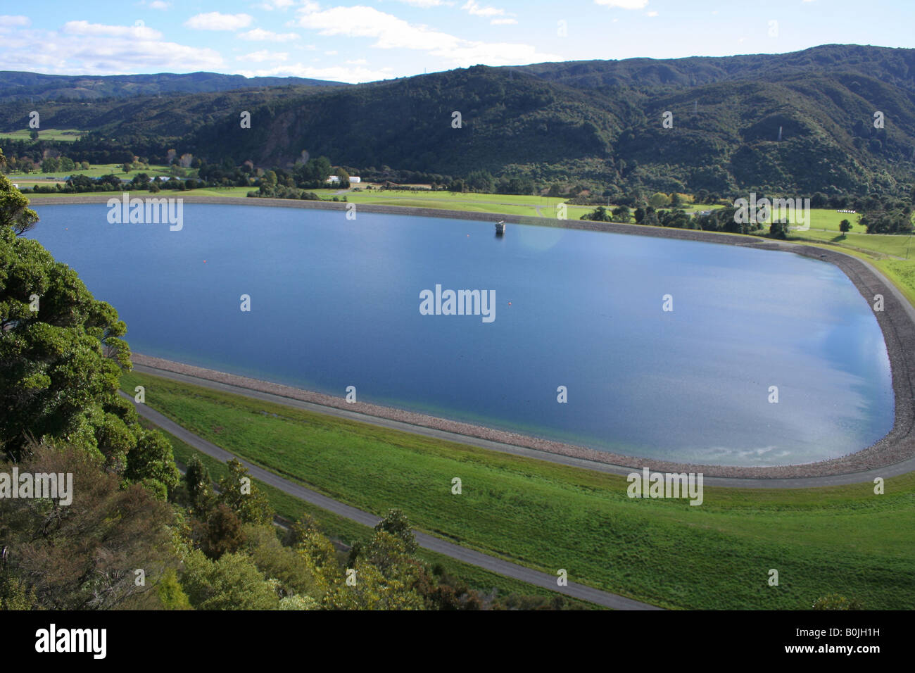 Water storage lake filled with water Stock Photo - Alamy