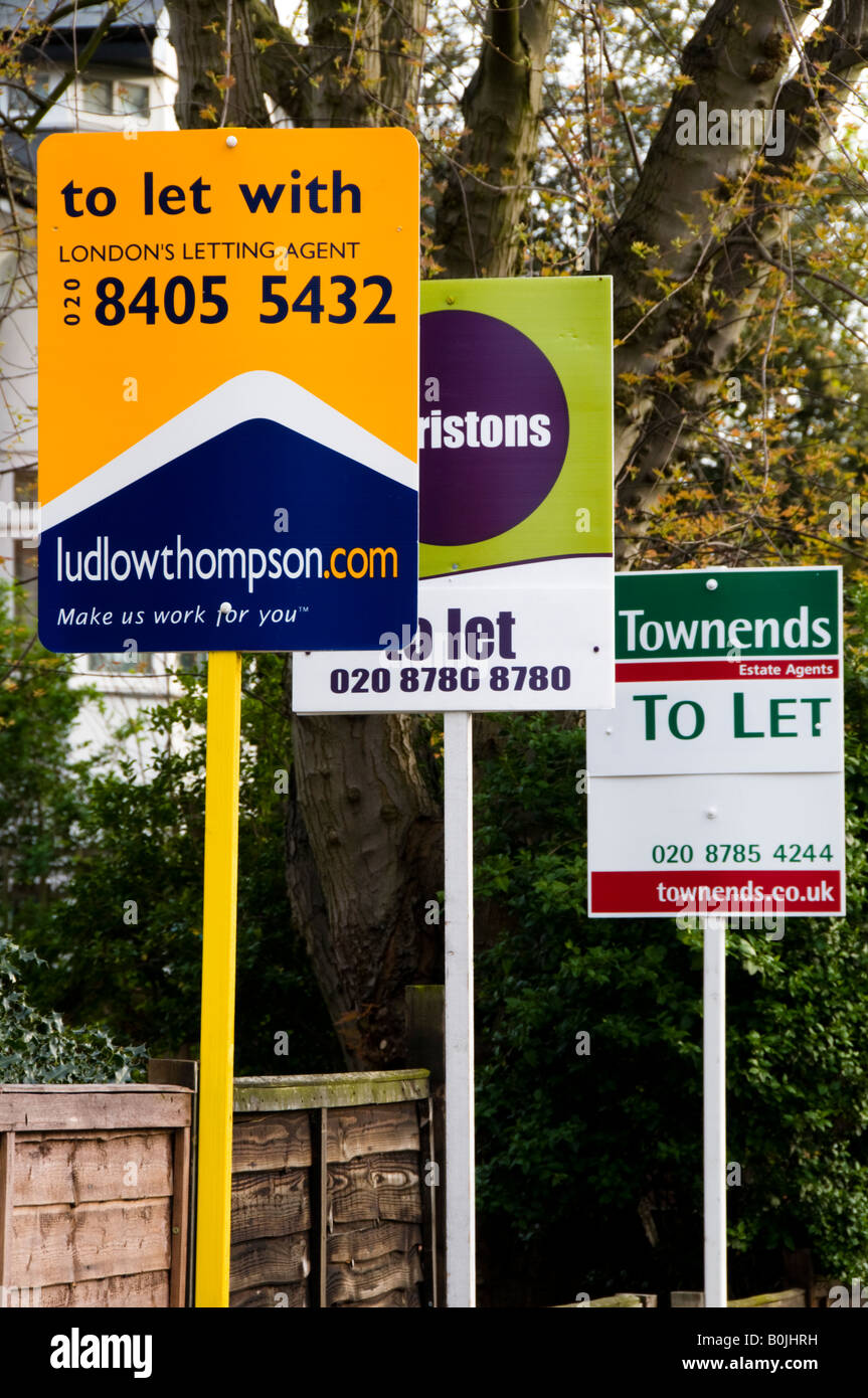 To Let Signs of various Estate Agents Stock Photo - Alamy