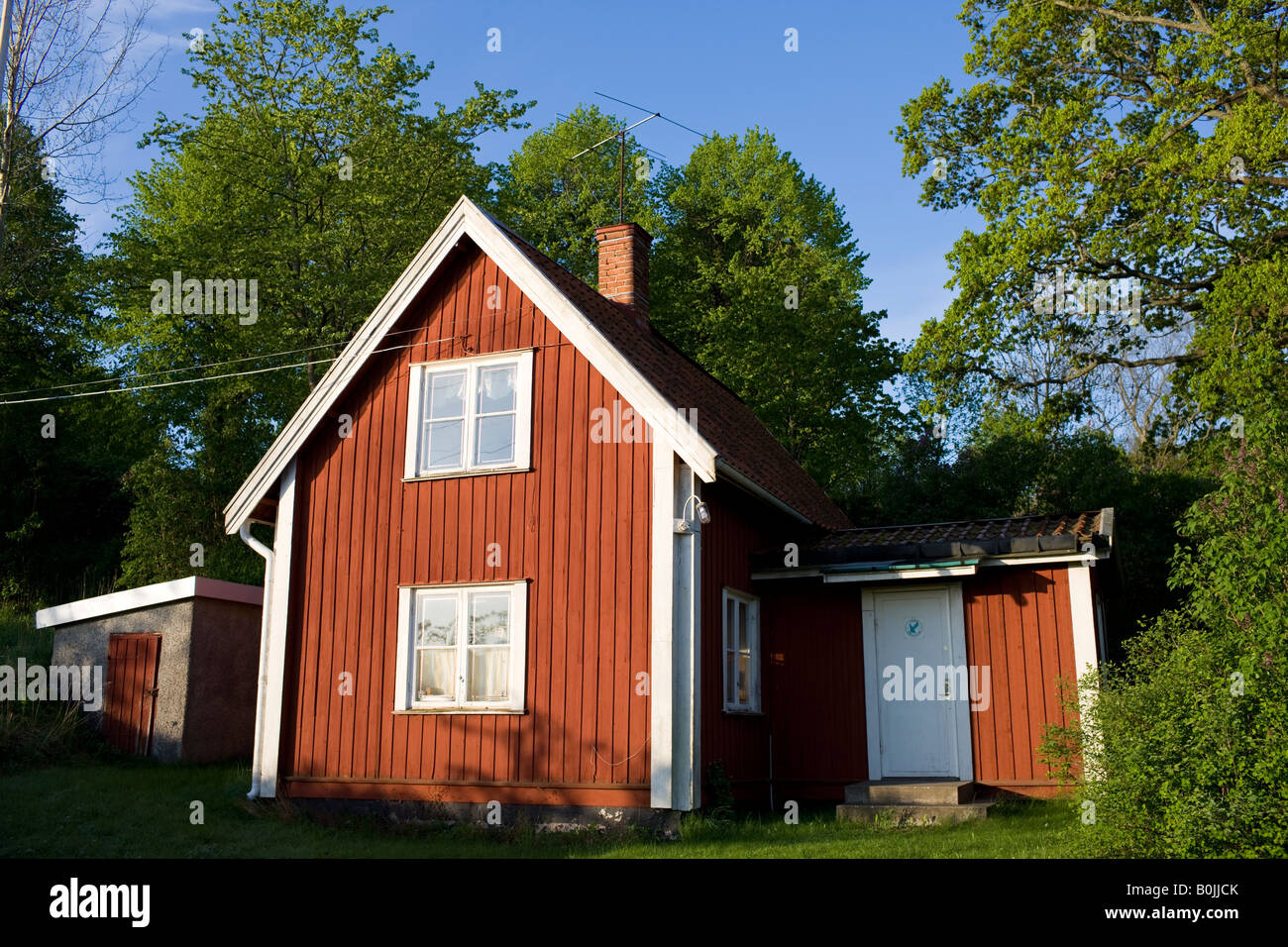 Red wooden house Stock Photo - Alamy
