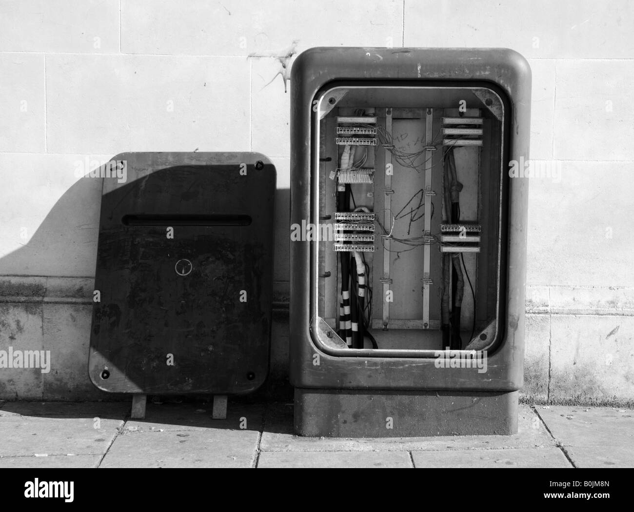 A disused telephone exchange box left with its front panel off on a ...