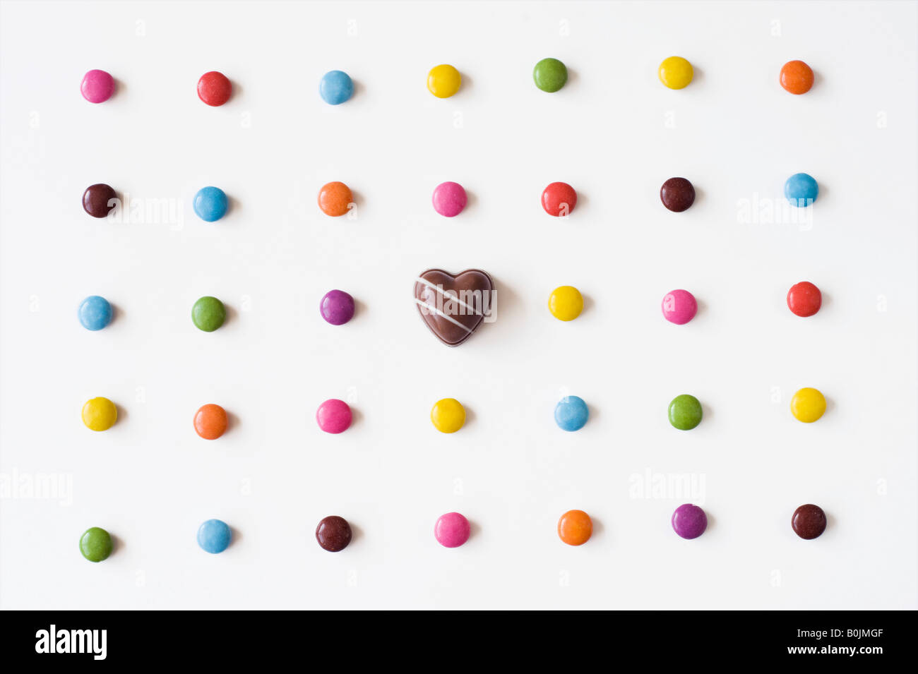 Smarties and a chocolate heart Stock Photo - Alamy