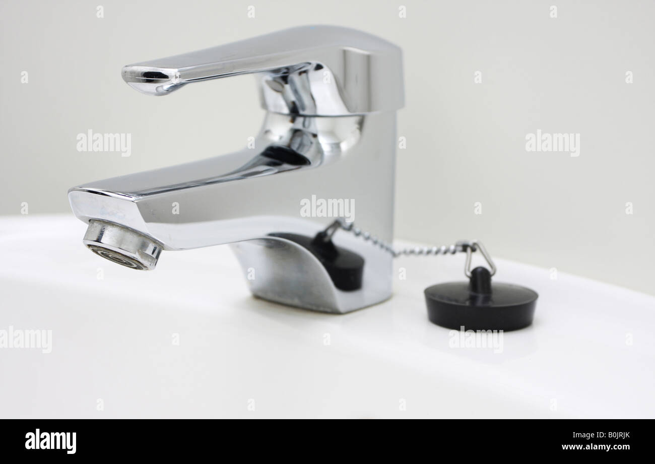 chrome faucet on a sink no running water Stock Photo - Alamy