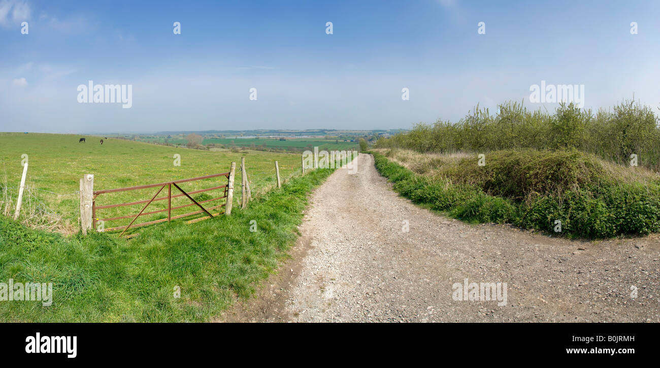 footpath on hill towards valley in distance Stock Photo - Alamy
