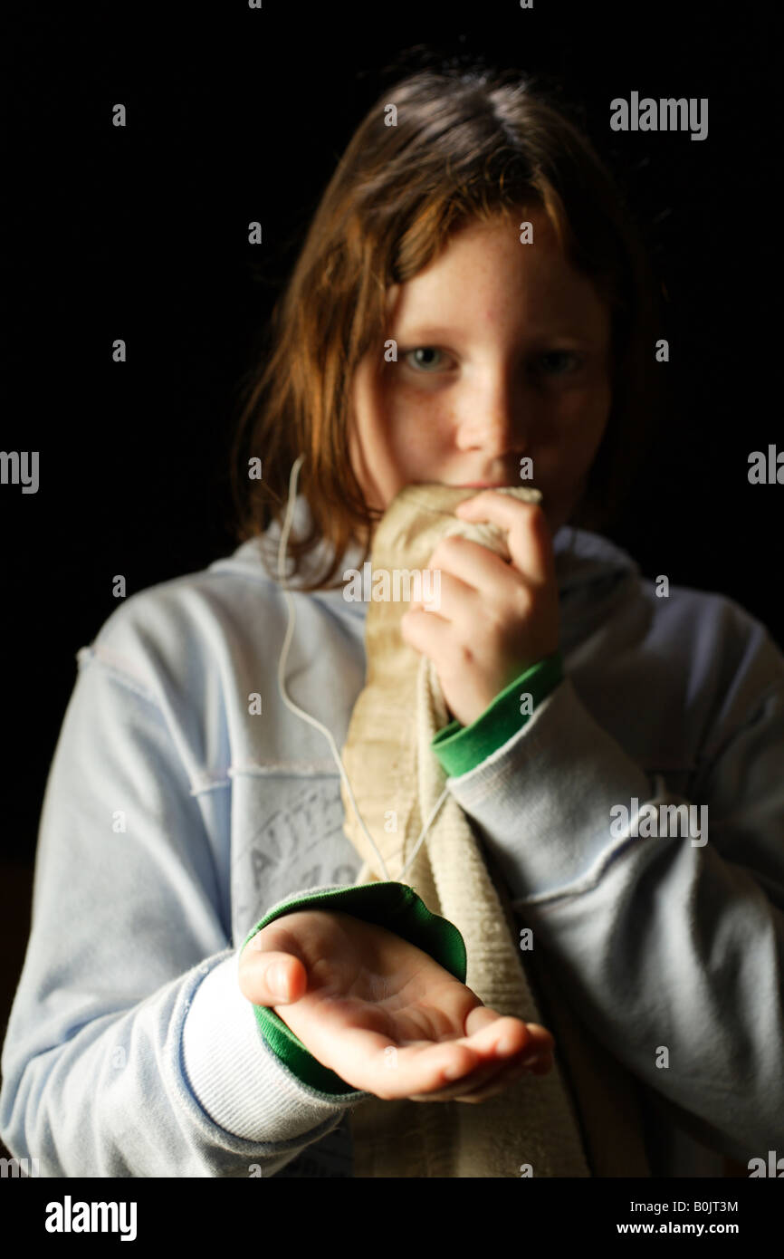 Girl asking for money with hand extended Stock Photo - Alamy