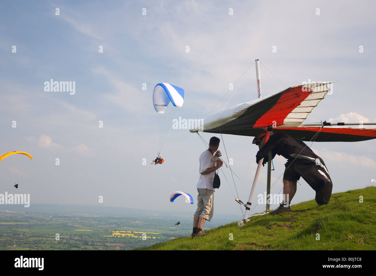 Hang-glider with para-gliders, Malvern Hills, Worcs., UK Stock Photo ...