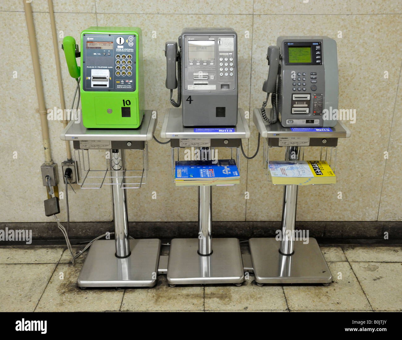 Three public telephones inside a subway station in Tokyo Japan Stock ...