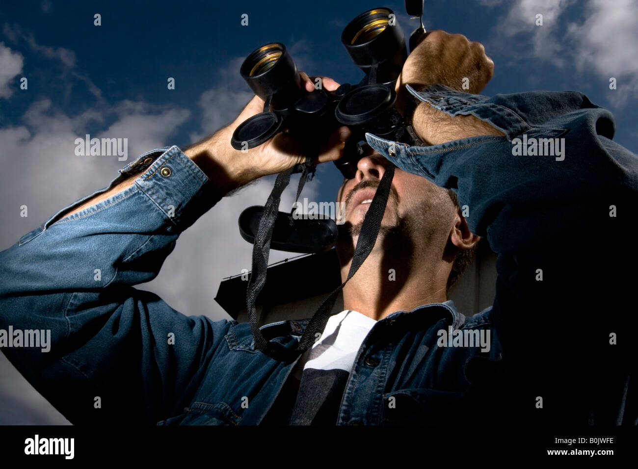 Man using binocular Stock Photo - Alamy