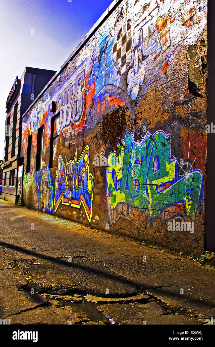 A graffiti covered wall in an alley off of Melrose Avenue in Los ...