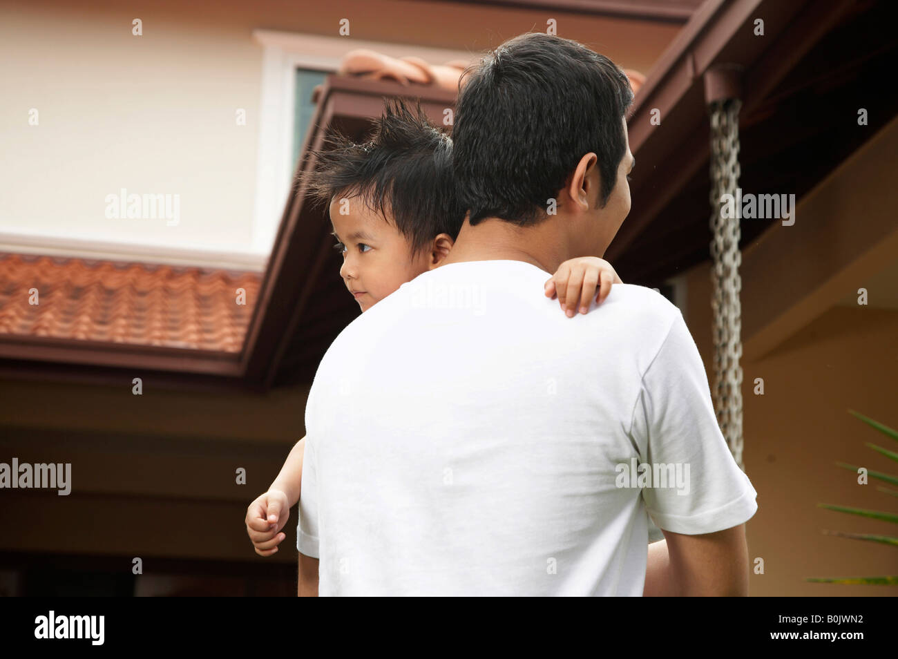 Boy hugging his dad Stock Photo - Alamy