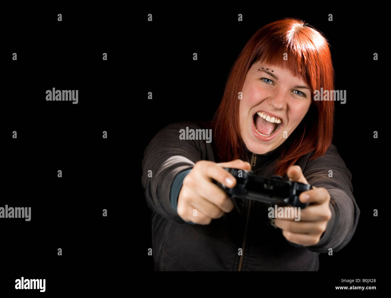 Girl using the sixaxis game controller and playing video games on her ...