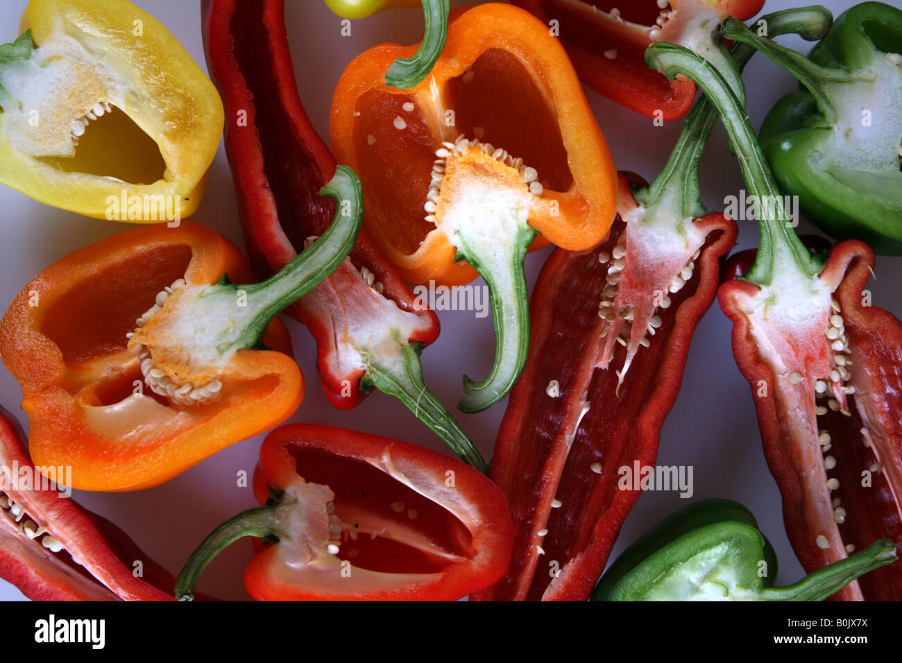 Coloured Peppers Sliced in half Stock Photo - Alamy