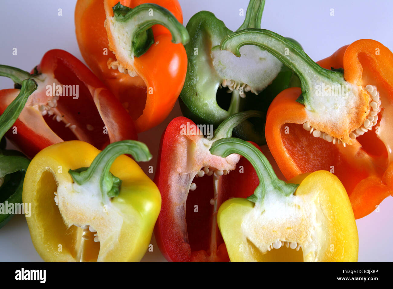 Coloured Bell Peppers Sliced in half Stock Photo - Alamy