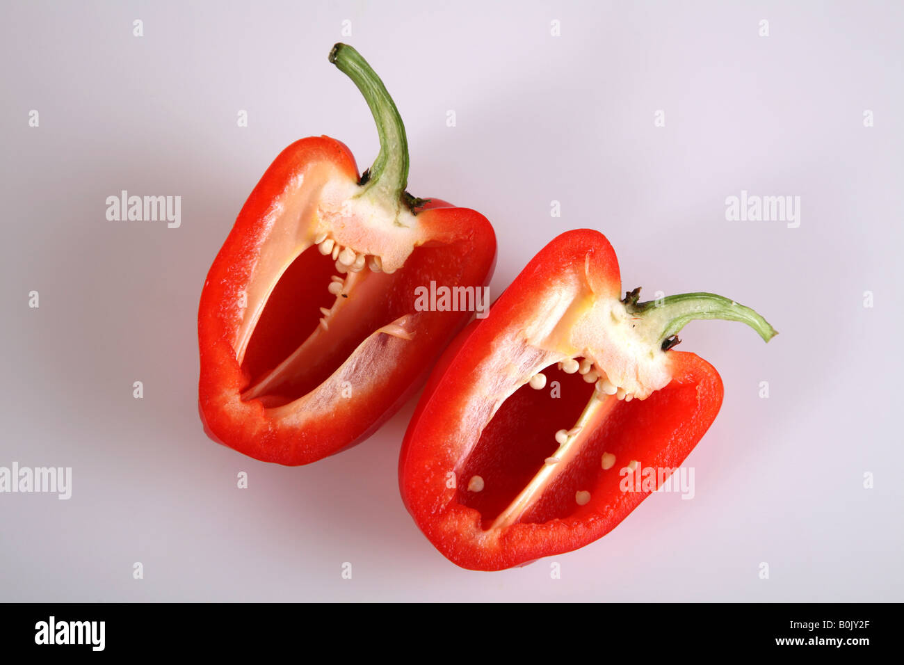 Red Bell Pepper Sliced in half Stock Photo - Alamy